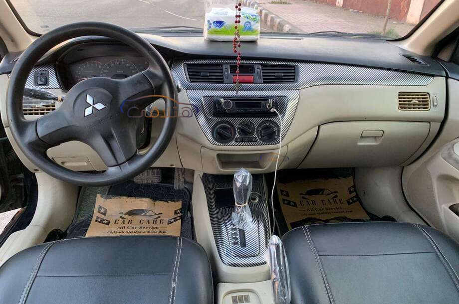 Lancer Puma Mitsubishi 2009 Asyut Black 6274485 - Car for sale : Hatla2ee