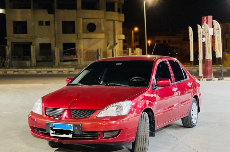 Lancer Puma Mitsubishi 2011 El Minya Red 6332056 - Car for sale : Hatla2ee