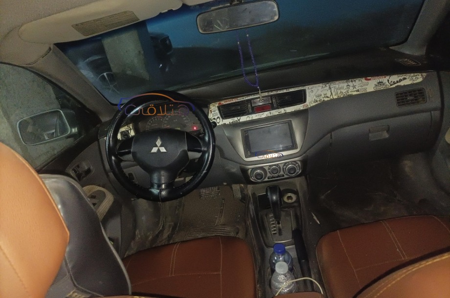 Lancer Puma Mitsubishi 2010 Giza Silver 6354094 - Car for sale : Hatla2ee