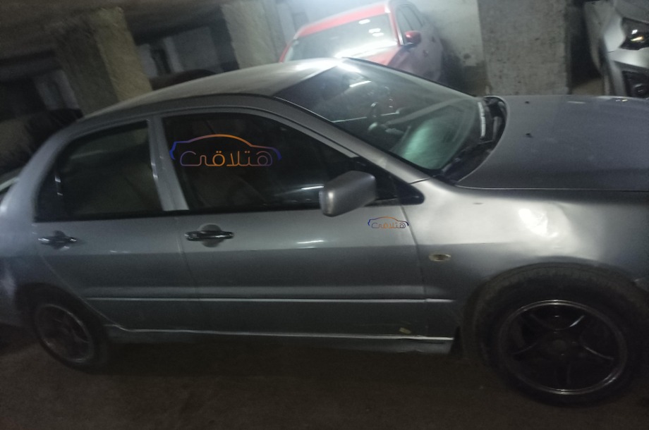 Lancer Puma Mitsubishi 2010 Giza Silver 6354094 - Car for sale : Hatla2ee