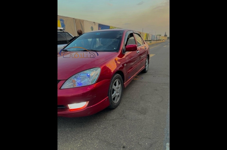 Lancer Puma Mitsubishi 2009 Gharbia Red 6357461 - Car for sale : Hatla2ee