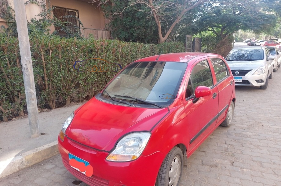 Spark Chevrolet 2010 6 October Red 6359870 - Car for sale : Hatla2ee