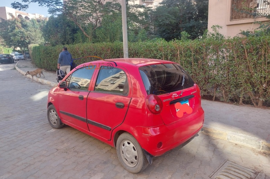 Spark Chevrolet 2010 6 October Red 6359870 - Car for sale : Hatla2ee