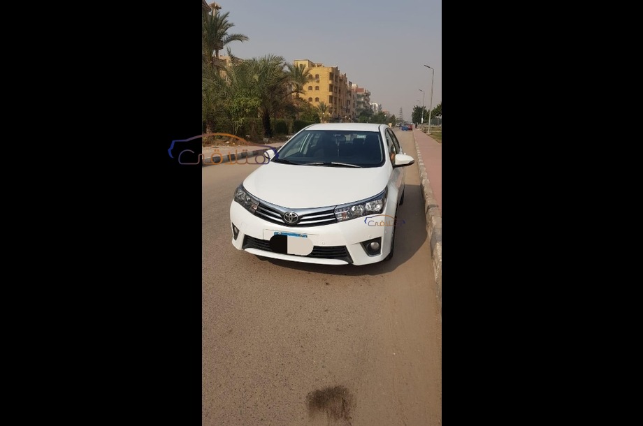 Corolla Toyota 2014 10th of Ramadan White 6427904 - Car for sale : Hatla2ee