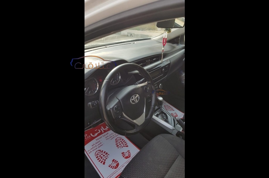 Corolla Toyota 2014 10th of Ramadan White 6427904 - Car for sale : Hatla2ee
