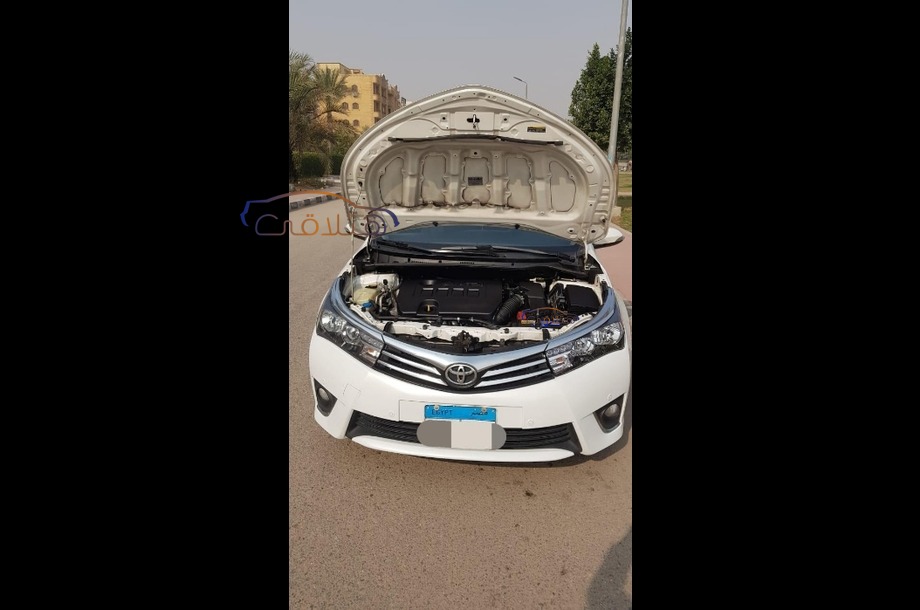 Corolla Toyota 2014 10th of Ramadan White 6427904 - Car for sale : Hatla2ee