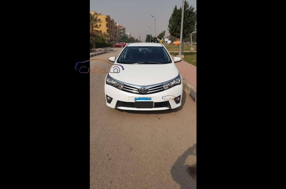 Corolla Toyota 2014 10th of Ramadan White 6427904 - Car for sale : Hatla2ee