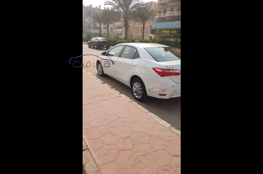 Corolla Toyota 2014 10th of Ramadan White 6427904 - Car for sale : Hatla2ee