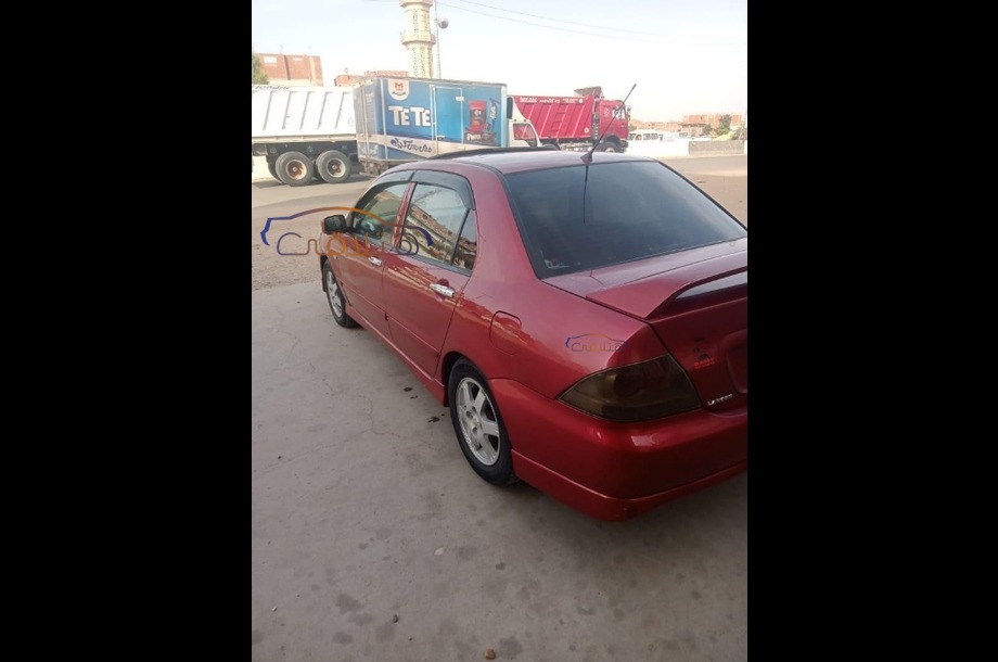 Lancer Puma Mitsubishi 2009 Cairo Red 6429471 - Car for sale : Hatla2ee