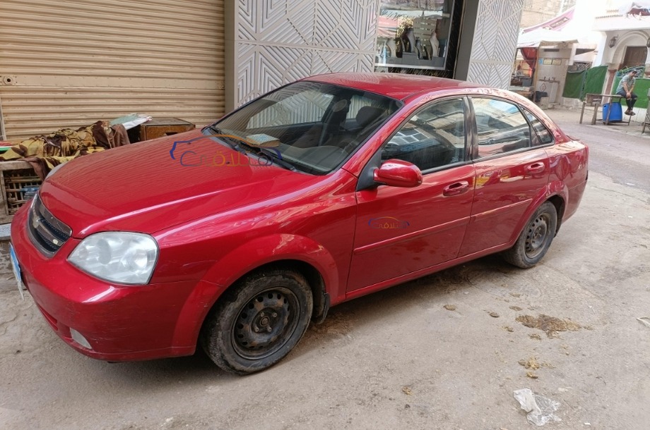 Optra Chevrolet 2010 Kafr el-Dawwar Red 6442075 - Car for sale : Hatla2ee