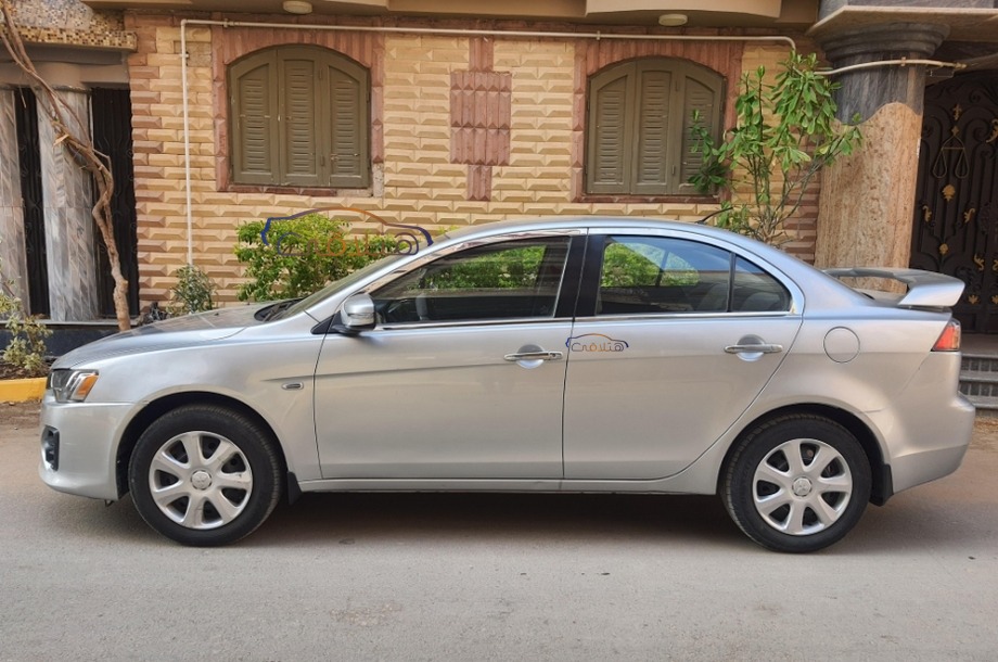 Lancer Mitsubishi 2017 6 October Silver 6480783 - Car for sale : Hatla2ee