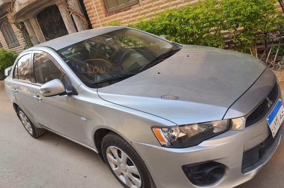Lancer Mitsubishi 2017 6 October Silver 6480783 - Car for sale : Hatla2ee