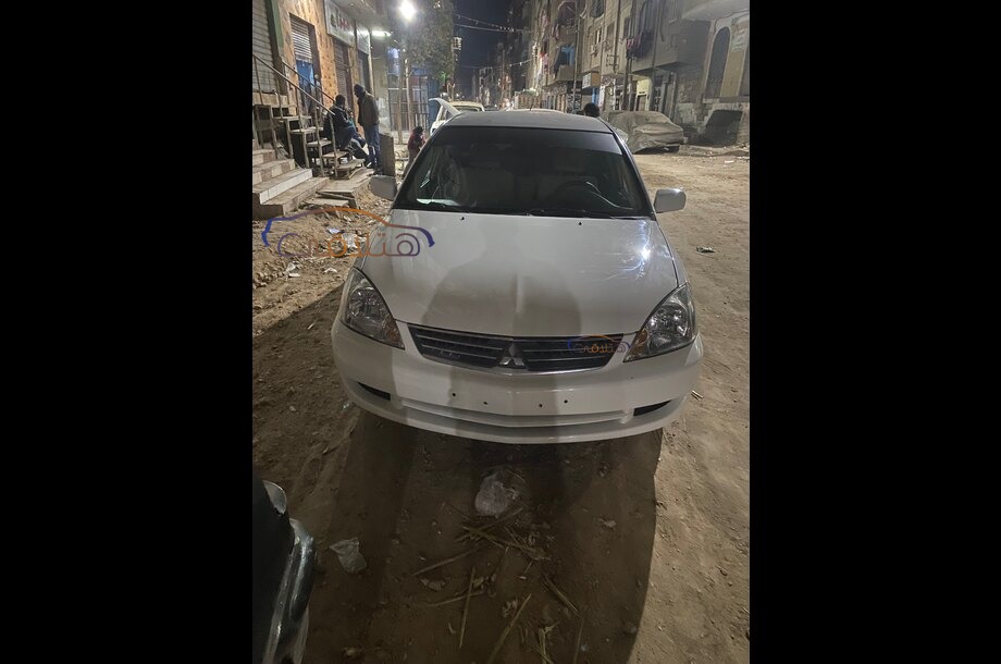 Lancer Puma Mitsubishi 2011 Giza White 6484167 - Car for sale : Hatla2ee