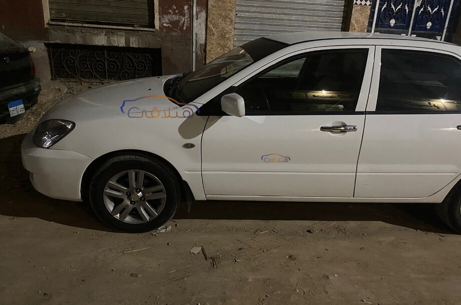 Lancer Puma Mitsubishi 2011 Giza White 6484167 - Car for sale : Hatla2ee