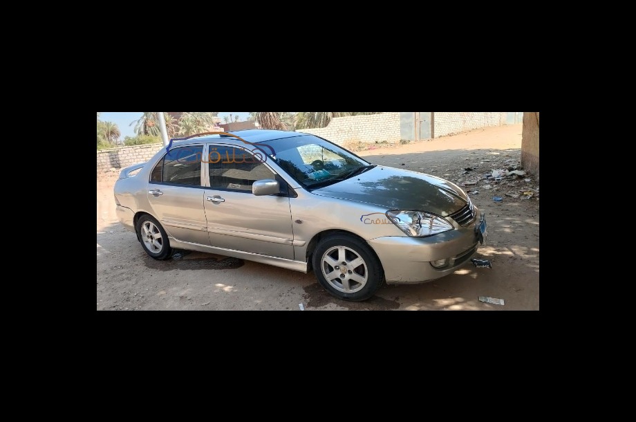 Lancer Puma Mitsubishi 2009 Luxor Silver 6503895 - Car for sale : Hatla2ee