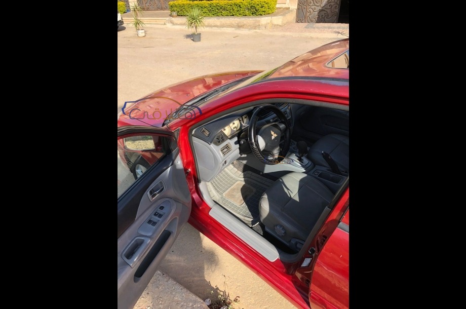 Lancer Puma Mitsubishi 2010 6 October Red 6510873 - Car for sale : Hatla2ee