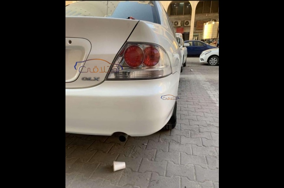 Lancer Puma Mitsubishi 2014 Sohag White 6543000 - Car for sale : Hatla2ee