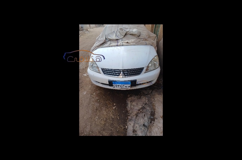 Lancer Puma Mitsubishi 2014 Sohag White 6543000 - Car for sale : Hatla2ee