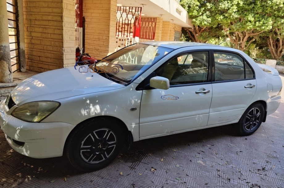 Lancer Puma Mitsubishi 2007 Faiyum White 6564437 - Car for sale : Hatla2ee