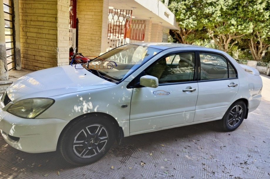 Lancer Puma Mitsubishi 2007 Faiyum White 6564437 - Car for sale : Hatla2ee
