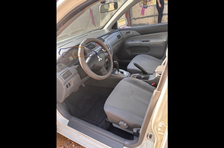 Lancer Puma Mitsubishi 2014 Faiyum White 6569909 - Car for sale : Hatla2ee