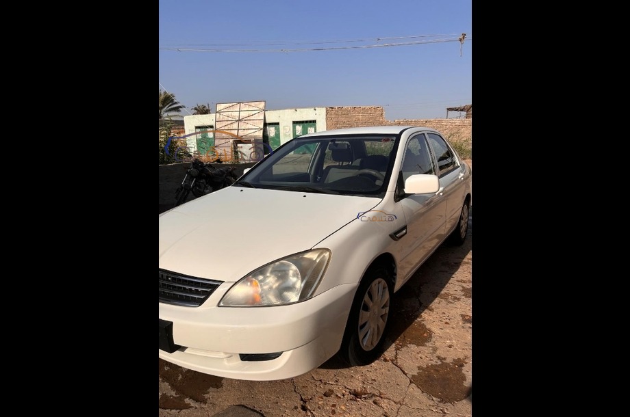 Lancer Puma Mitsubishi 2014 Faiyum White 6569909 - Car for sale : Hatla2ee