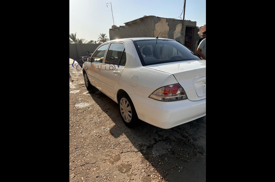 Lancer Puma Mitsubishi 2014 Faiyum White 6569909 - Car for sale : Hatla2ee