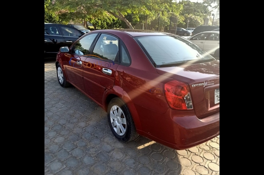 Optra Chevrolet 2013 Nasr city Red 6575784 - Car for sale : Hatla2ee