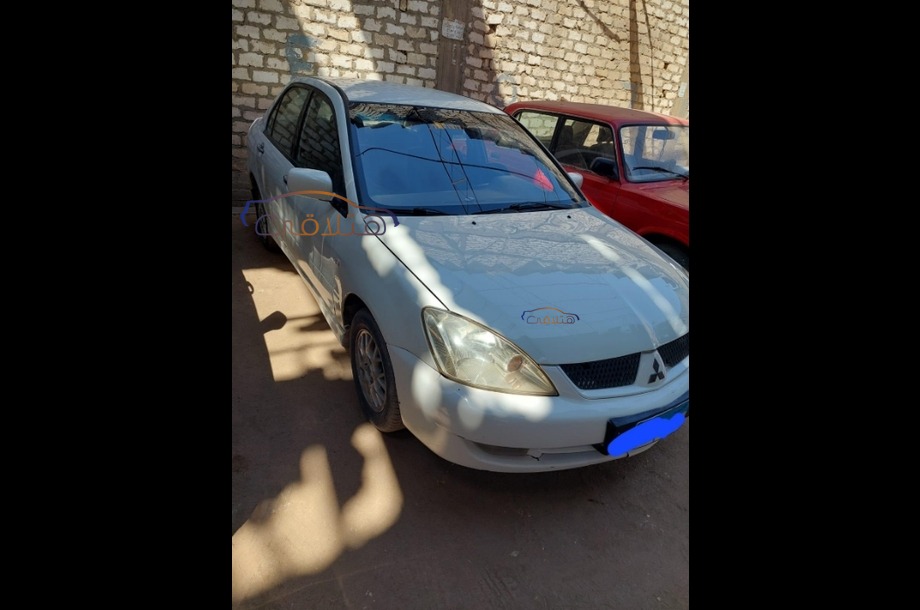 Lancer Puma Mitsubishi 2005 Cairo White 6590093 - Car for sale : Hatla2ee