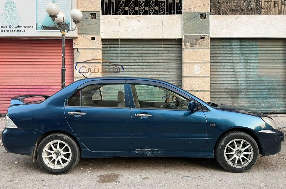 Lancer Puma Mitsubishi 2010 El Haram Blue 6597116 - Car for sale : Hatla2ee