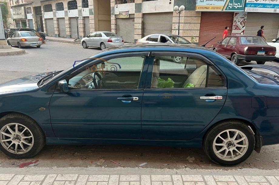 Lancer Puma Mitsubishi 2010 El Haram Blue 6597116 - Car for sale : Hatla2ee