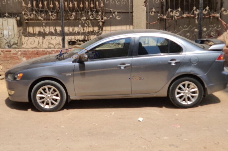 Lancer Mitsubishi 2015 El Haram Dark grey 6674619 - Car for sale : Hatla2ee