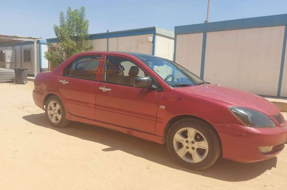 Lancer Puma Mitsubishi 2010 Nasr city Dark red 6677134 - Car for sale ...