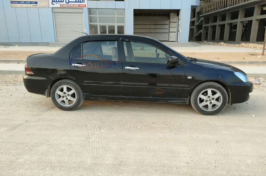 Lancer Puma Mitsubishi 2007 Zagazig Black 6689516 - Car for sale : Hatla2ee