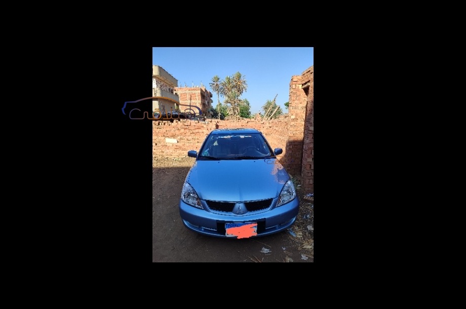 Lancer Puma Mitsubishi 2003 Gharbia White 6713753 - Car for sale : Hatla2ee