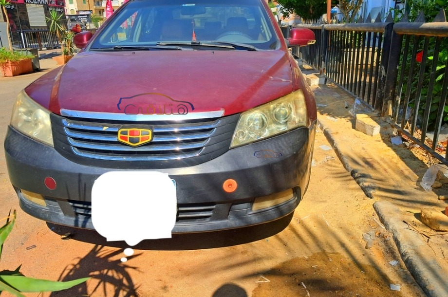 Emgrand 7 Geely 2014 6 October Dark red 6715810 - Car for sale : Hatla2ee