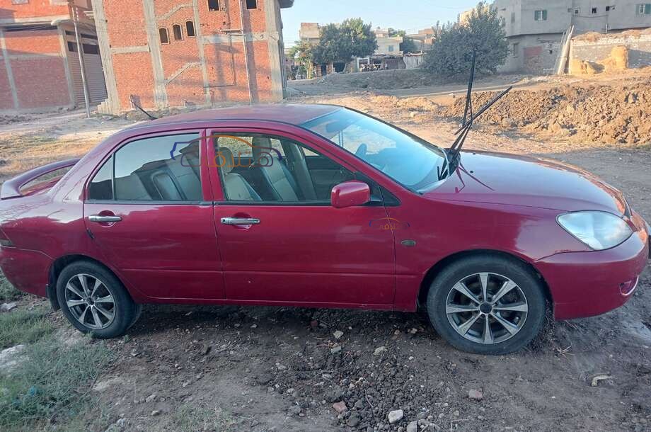 Lancer Puma Mitsubishi 2008 Mansoura Red 6717193 - Car for sale : Hatla2ee