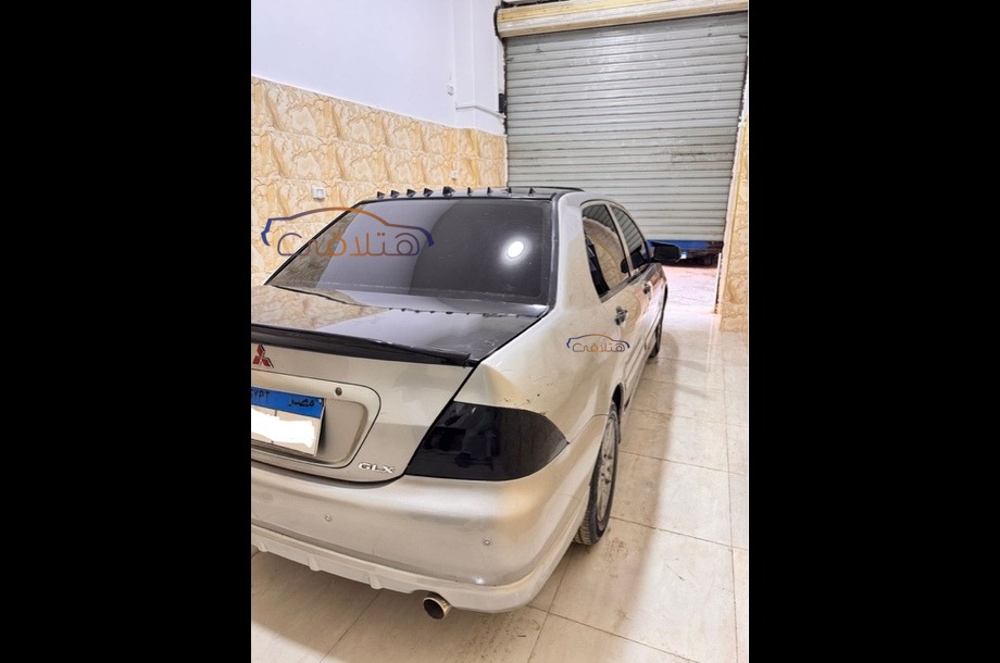 Lancer Puma Mitsubishi 2010 Agamy Silver 6725449 - Car for sale : Hatla2ee