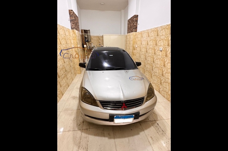 Lancer Puma Mitsubishi 2010 Agamy Silver 6725449 - Car for sale : Hatla2ee
