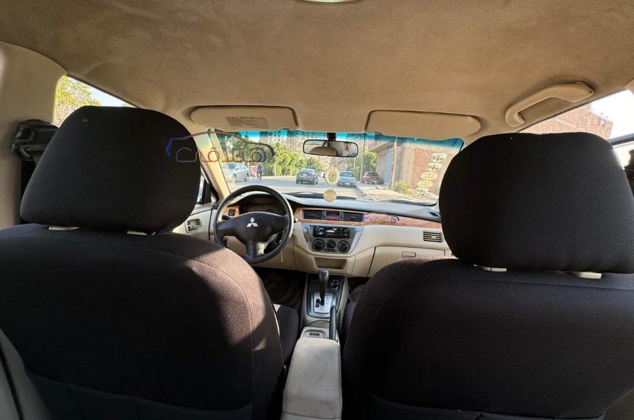 Lancer Puma Mitsubishi 2010 Faiyum White 6733765 - Car for sale : Hatla2ee