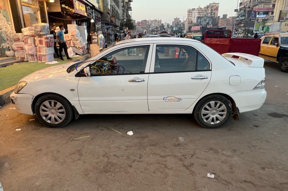 Lancer Puma Mitsubishi 2014 El Mahalla White 6737642 - Car for sale ...