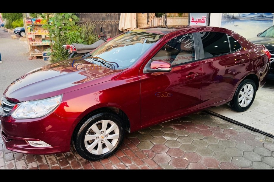 Optra Chevrolet 2022 6 October Dark red 6759053 - Car for sale : Hatla2ee