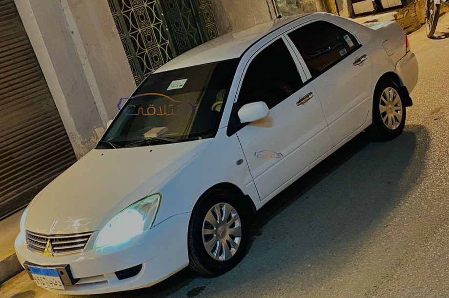 Lancer Puma Mitsubishi 2014 Zagazig White 6762983 - Car for sale : Hatla2ee