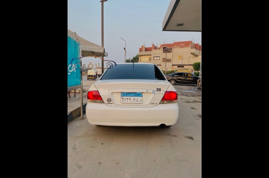 Lancer Puma Mitsubishi 2014 Zagazig White 6762983 - Car for sale : Hatla2ee