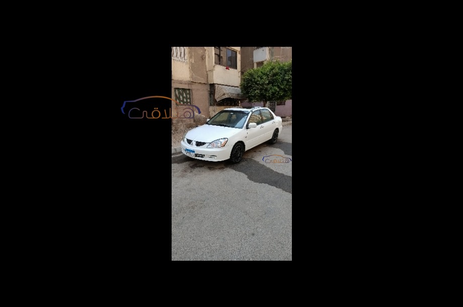 Lancer Puma Mitsubishi 2001 Helwan White 6789548 - Car for sale : Hatla2ee