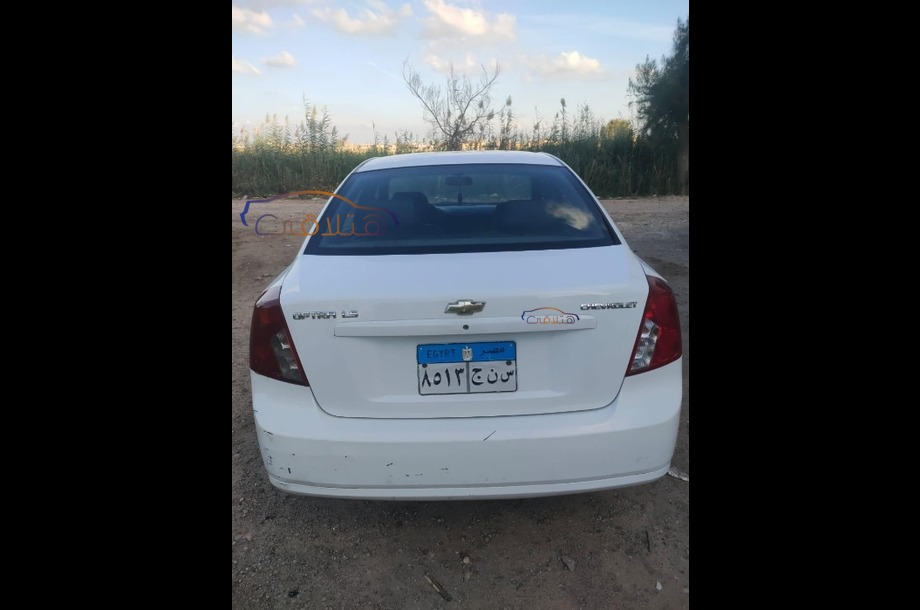 Optra Chevrolet 2014 Kafr el-Dawwar White 6804016 - Car for sale : Hatla2ee