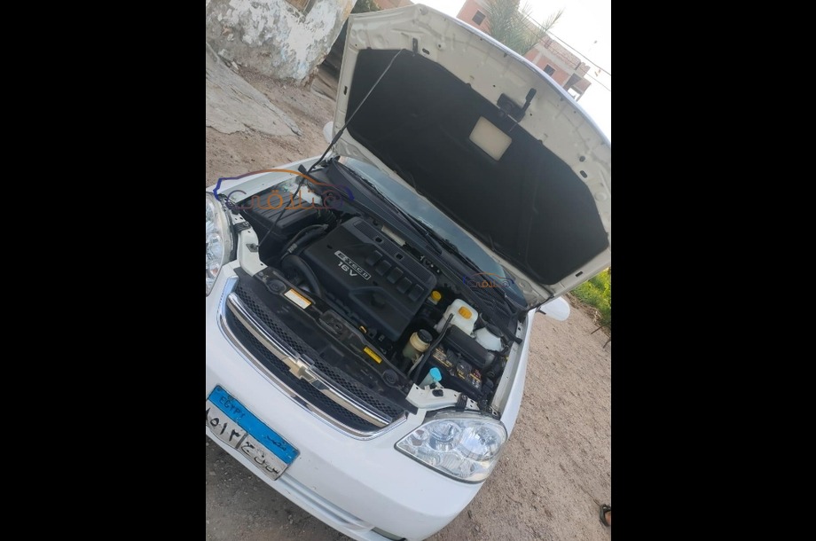 Optra Chevrolet 2014 Kafr el-Dawwar White 6804016 - Car for sale : Hatla2ee