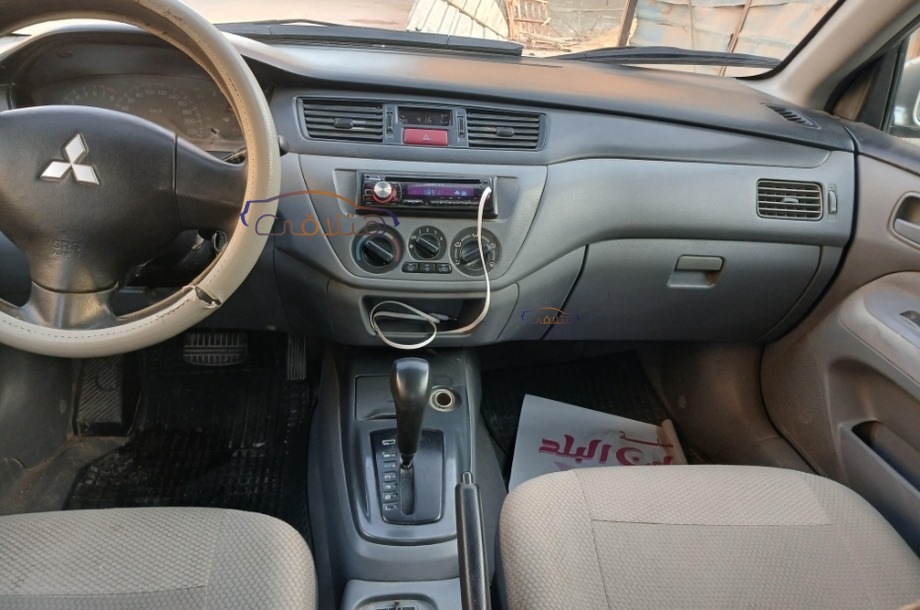Lancer Puma Mitsubishi 2010 Faiyum Silver 6829381 - Car for sale : Hatla2ee