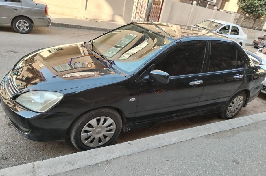 Lancer Puma Mitsubishi 2010 Cairo Black 6841808 - Car for sale : Hatla2ee
