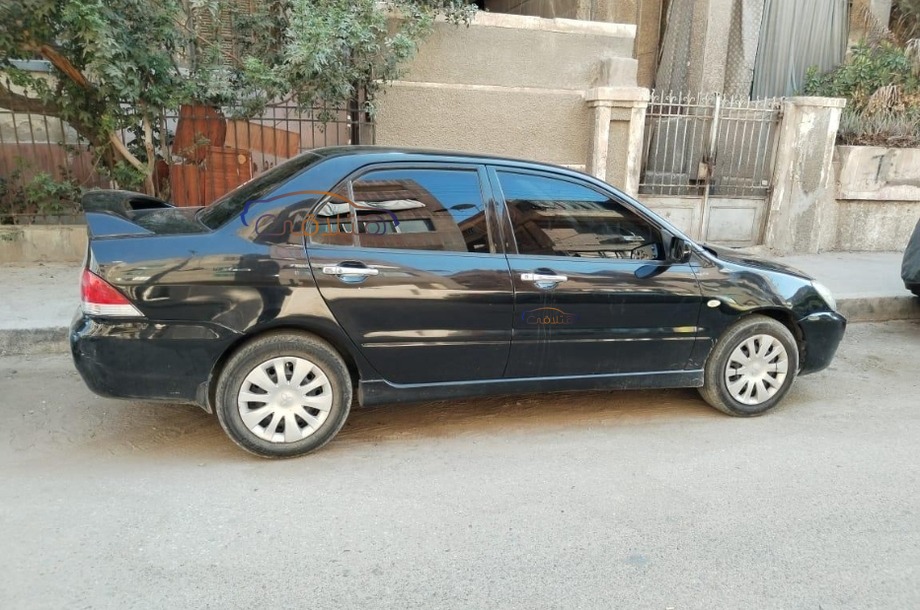 Lancer Puma Mitsubishi 2010 Cairo Black 6841808 - Car for sale : Hatla2ee